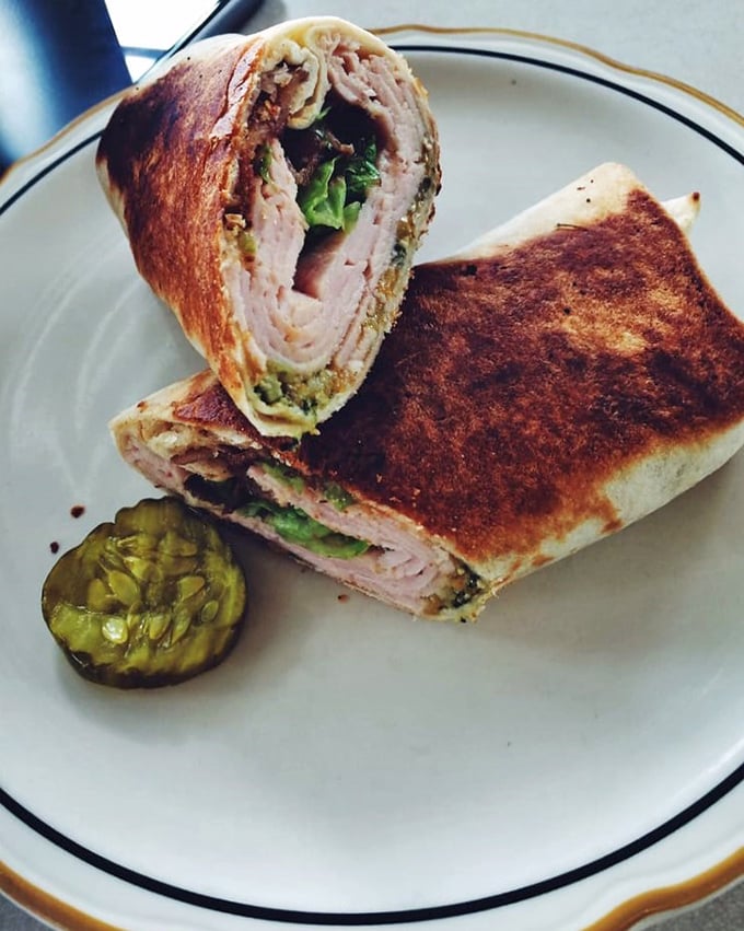 This isn't just a sandwich; it's architectural genius &ndash; layers of flavor stacked with the precision of a Jenga master who really understands lunch.