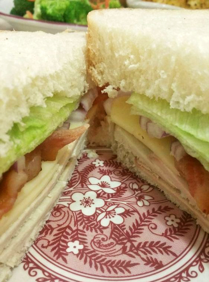 Layer upon layer of fresh ingredients create a sandwich masterpiece that makes you wonder why you ever settled for drive-thru disappointments.