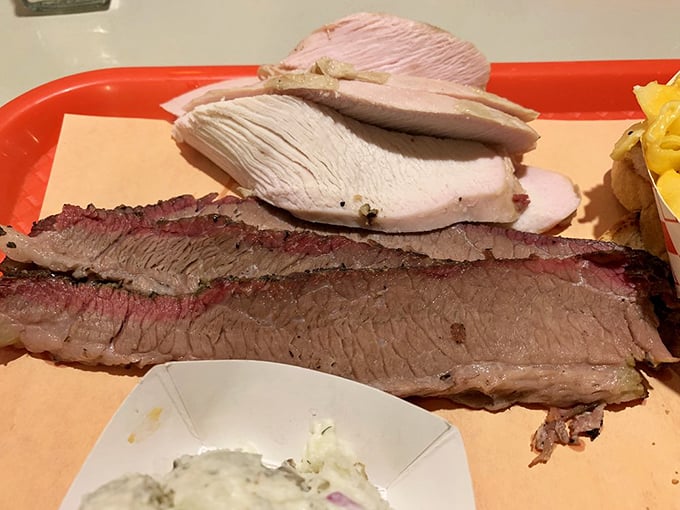 Turkey and brisket sharing a plate like old friends at a reunion &ndash; one lean, one rich, both transformed by the magic of smoke.