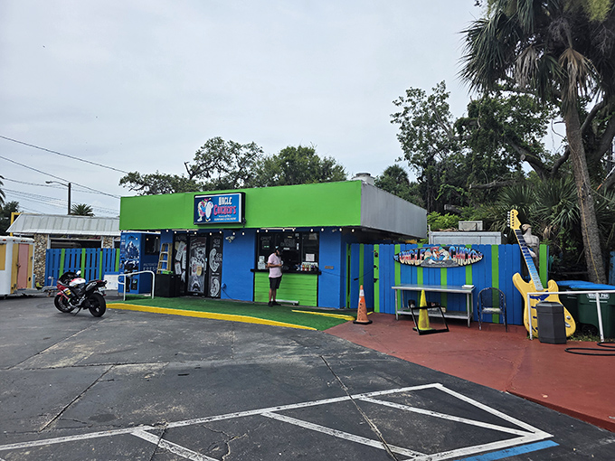 Uncle Chicken's vibrant facade pops against the Florida sky. The kind of local joint where calories don't count and napkins are absolutely necessary. 