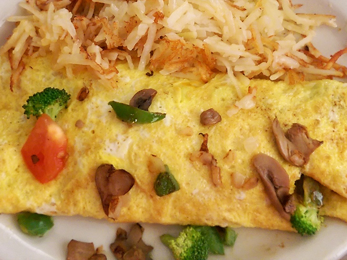 An omelet that doesn't just include vegetables&mdash;it celebrates them. Those hash browns peeking from behind deserve their own fan club.