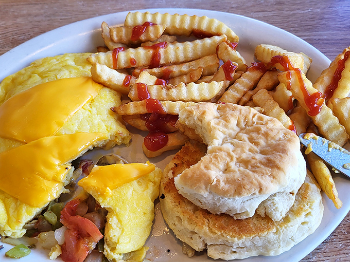 Breakfast gets dressed up with fresh avocado slices that add buttery richness to an English muffin base – proof that classics can evolve gracefully.