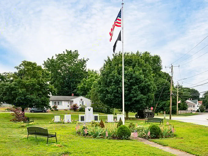 The veterans memorial stands guard over green spaces where memories and manicured lawns meet with dignity.