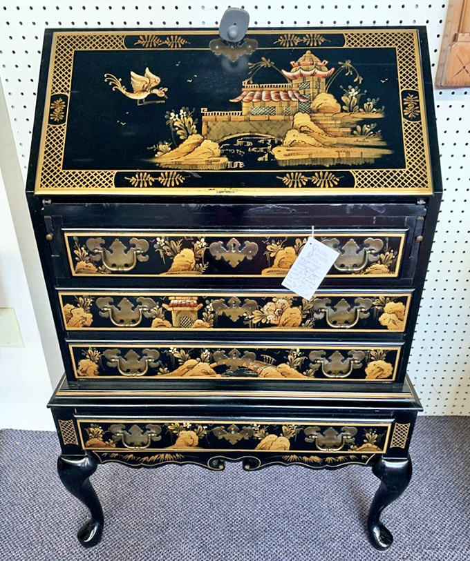 Eastern-inspired lacquer cabinet that whispers tales of silk roads and spice trades. Your IKEA bookshelf is suddenly feeling very inadequate.