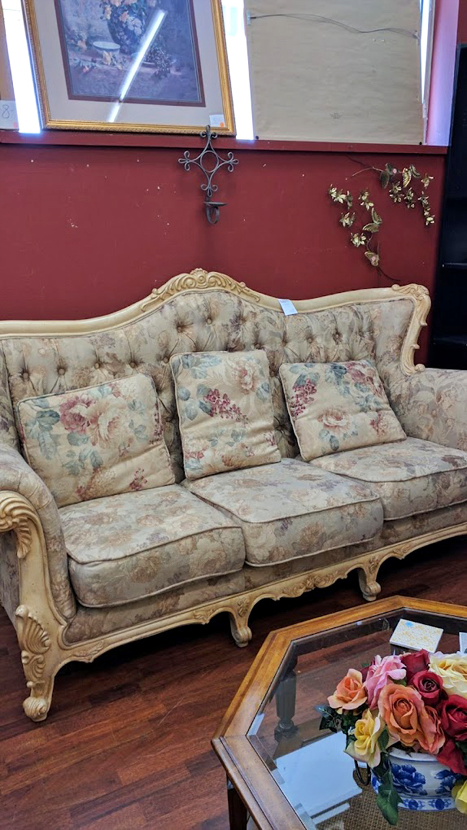 This vintage floral sofa isn't just furniture&mdash;it's a time machine to Grandma's living room, complete with the faint memory of plastic covers.