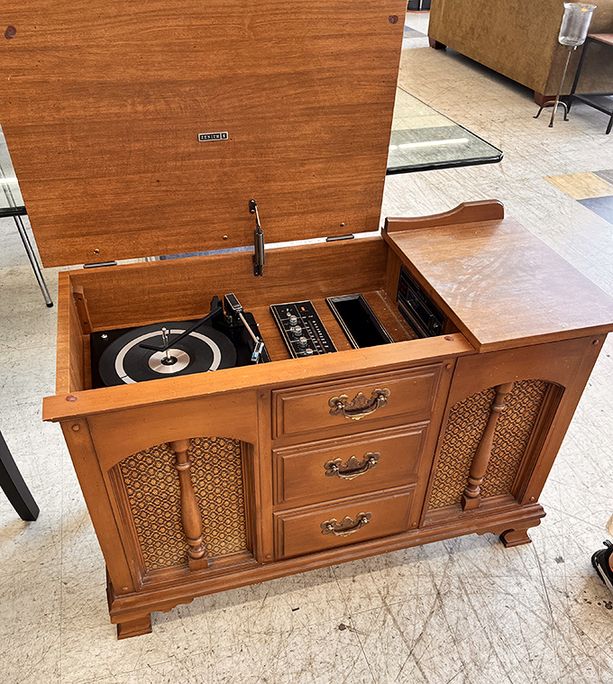 Not just a stereo, but a time capsule! This vintage console houses the ghosts of vinyl past, ready to play the soundtrack of someone's youth.
