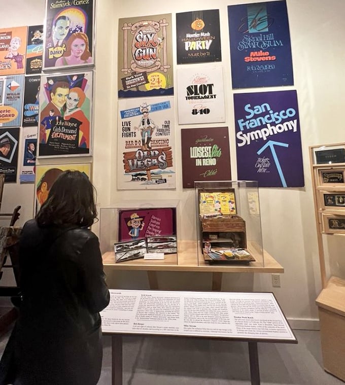 Museum visitors find themselves transported through decades of graphic design evolution, each poster telling stories of American entertainment.