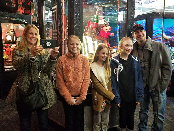Families creating memories that will outlast the fruitcake forgotten in the back of the fridge. These smiles are what Christmas spirit looks like in human form.