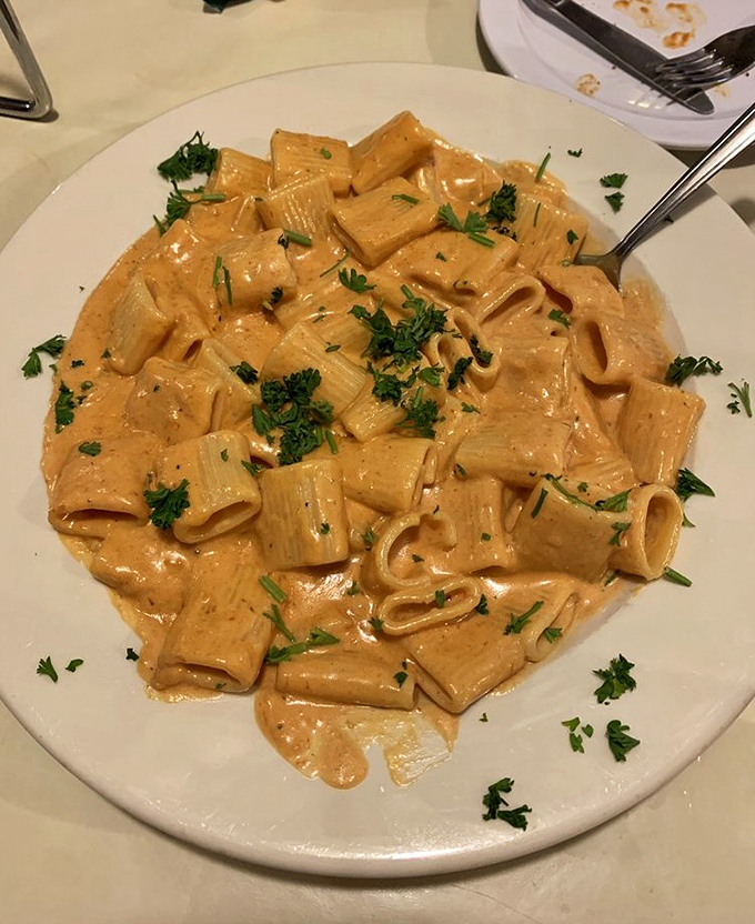 Pasta that doesn't play second fiddle to the pizza. This vodka rigatoni, with its blush-colored sauce and fresh herbs, proves Papa's isn't a one-hit wonder.