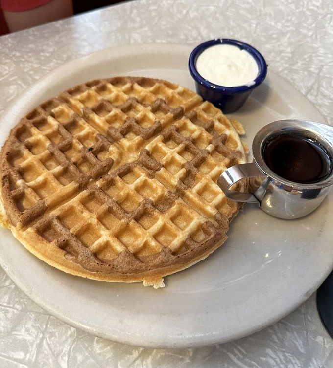 This golden waffle isn't just breakfast&mdash;it's an edible sunburst on a plate, complete with butter melting into each perfect square.