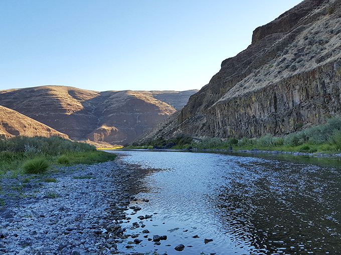 Twilight transforms the John Day River into liquid silver, reflecting millions of years of geological patience.