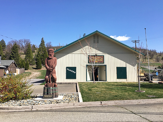 The Weed Historic Lumbertown Museum preserves stories of an era when men were men and trees were nervous. That wooden statue has seen things.