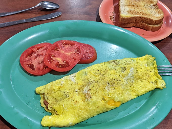 An omelet that doesn't need Instagram filters to look good&mdash;just fresh ingredients folded into fluffy eggs with slices of tomato standing guard.