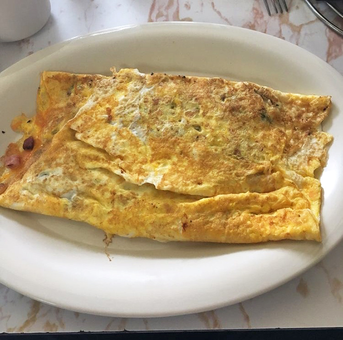 This Western omelet isn't trying to impress food critics; it's too busy satisfying hungry Kentuckians who know breakfast isn't a trend, it's a tradition.