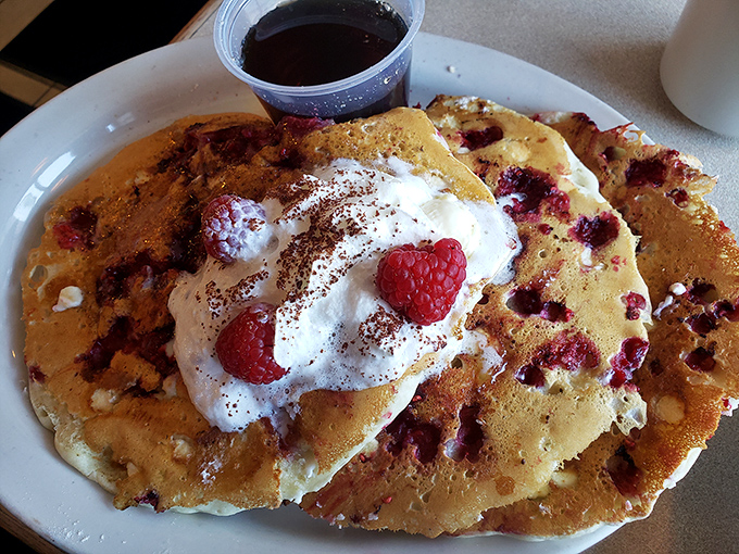 These raspberry pancakes aren't just breakfast&mdash;they're an edible love poem topped with whipped cream and berries that would make Shakespeare put down his quill in defeat.