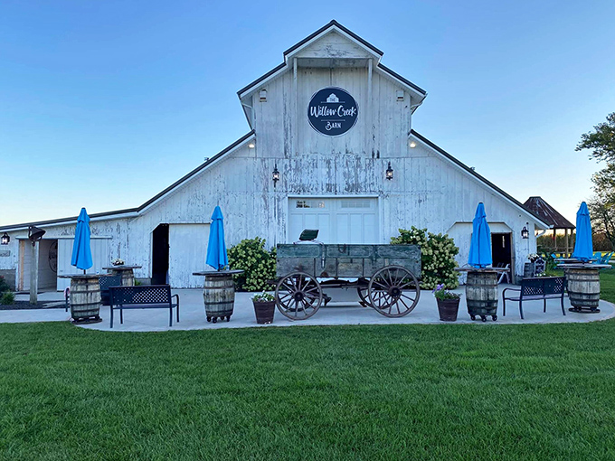 Willow Creek Barn transforms rural simplicity into Instagram-worthy charm. Those blue umbrellas aren't just for shade&mdash;they're invitations to sit awhile and forget about your portfolio.