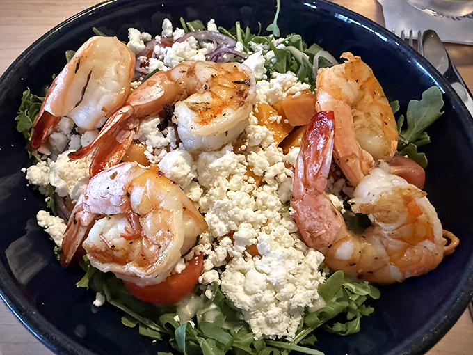 Grilled shrimp over fresh greens with crumbled cheese &ndash; proof that salads can actually be exciting dinner choices.