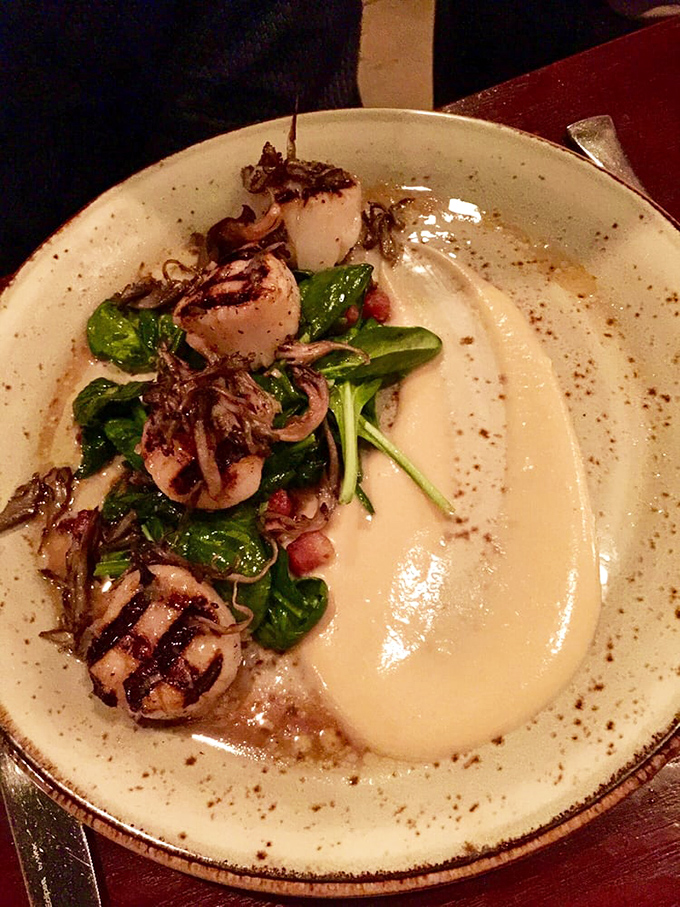 These scallops aren't just cooked&mdash;they're respected. Perfectly seared and nestled alongside vibrant greens, they're the ocean's candy.