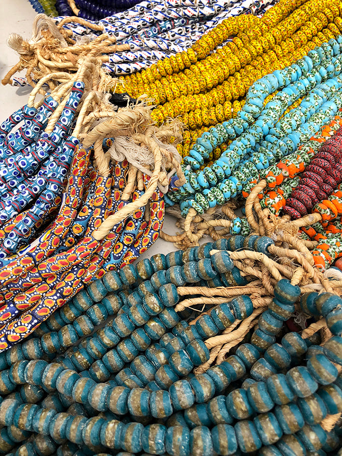 Beaded treasures in a kaleidoscope of blues, yellows and oranges &ndash; global artistry that transforms ordinary outfits into conversation starters.