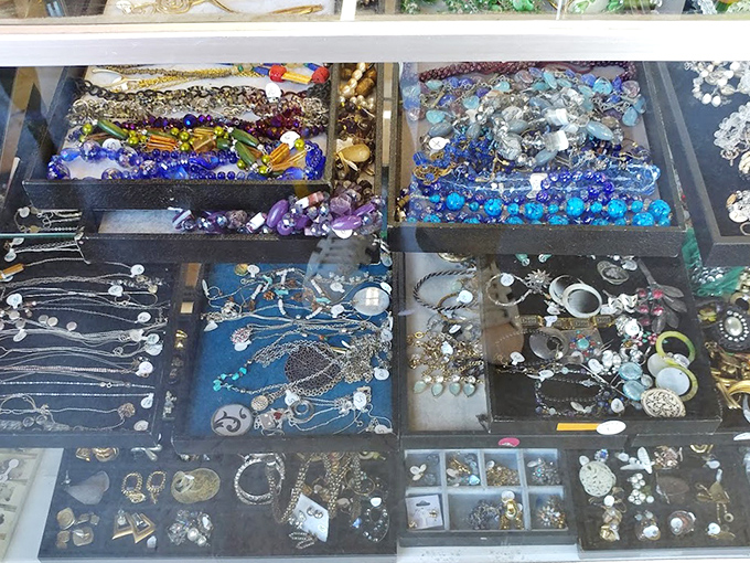 The jewelry case—where costume pieces with Hollywood histories mingle with genuine gems waiting for their second act. Treasure hunting at its finest!