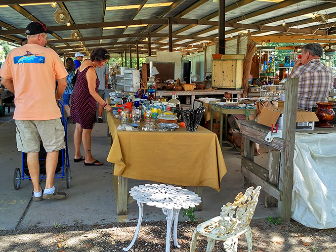 Browsers examine glassware while contemplating whether that yellow mustard-colored table might actually work in their dining room after all.
