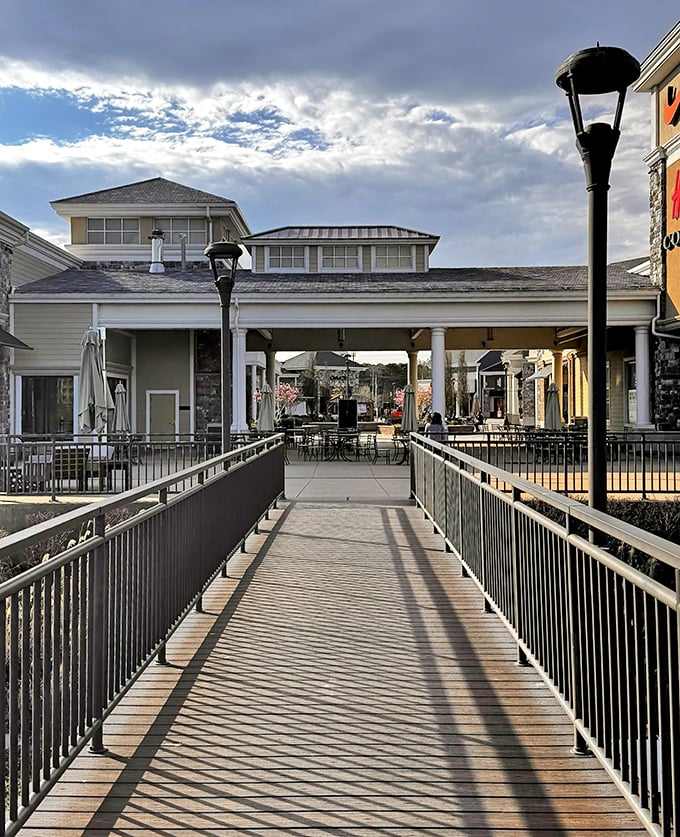 This inviting walkway bridges the gap between shopping sections, offering a moment of scenic tranquility between spending sprees.