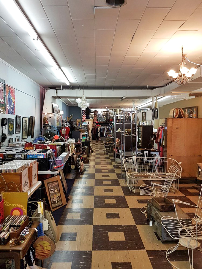 The checkered floor leads you deeper into wonderland, where vinyl records and vintage chairs await their second act in your home story.