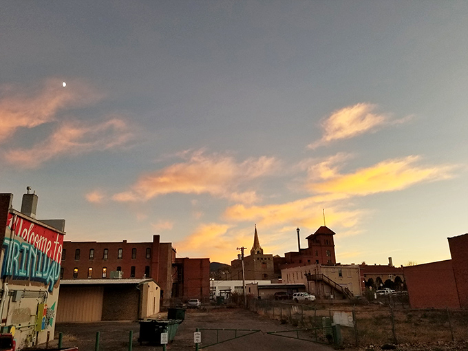 As sunset paints Trinidad's skyline, the town transforms into a watercolor of brick, spires, and golden light.