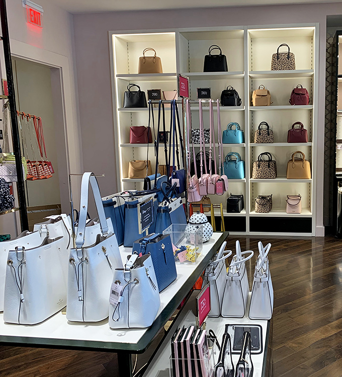 Handbag heaven or wallet purgatory? Designer purses arranged with museum-like precision, tempting you to believe that four new bags is completely reasonable.