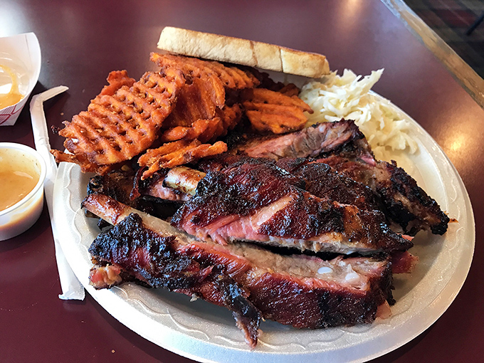 Ribs that make you question your table manners. That smoke ring is the barbecue equivalent of a Michelin star. 