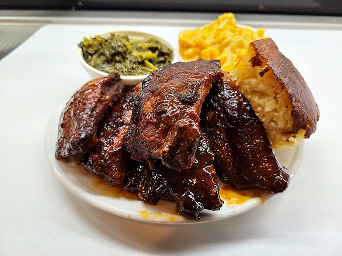 These ribs have clearly been slow-dancing with smoke and spice all day, resulting in meat that surrenders from the bone with barely a nudge.