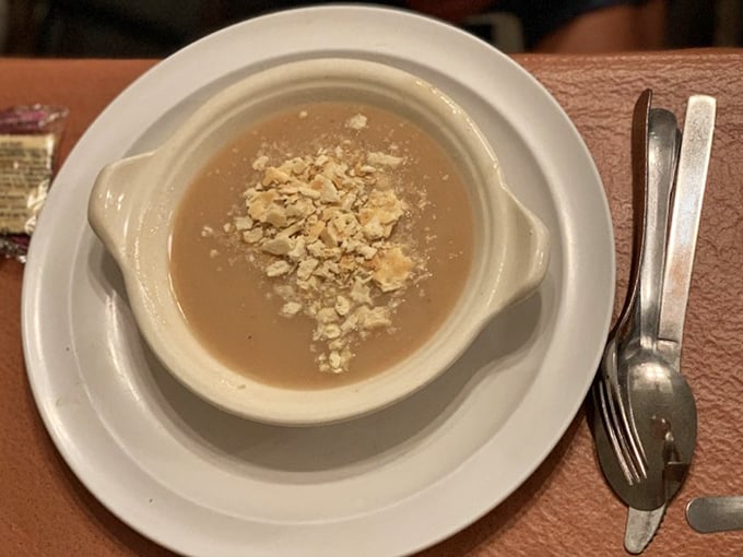 The bean soup arrives in a rustic crock, topped with crumbled crackers &ndash; humble beginnings for a meal that builds to epic proportions.