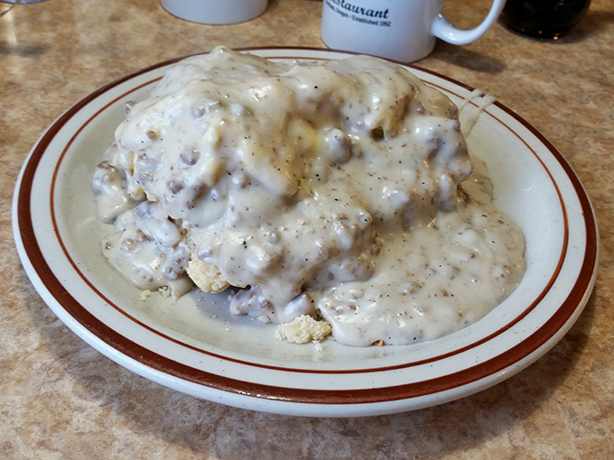 Biscuits and gravy so generous they're practically wearing a Santa suit. The pepper-speckled gravy blankets everything in velvety comfort.