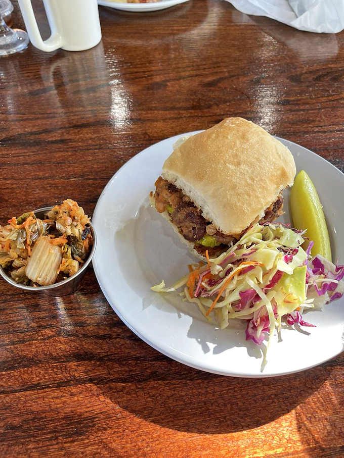This sandwich isn't just lunch; it's architecture with purpose&mdash;stacked high with fresh ingredients and paired with a rainbow slaw that means business.