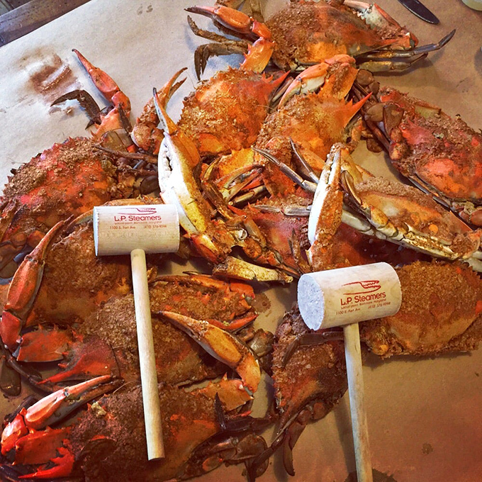 The wooden mallets stand ready for battle amid a sea of spice-crusted blue crabs&mdash;tools for the delicious treasure hunt that awaits.