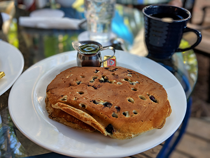 Blueberry pancakes that look like they're auditioning for a breakfast hall of fame, complete with the supporting actor role of real maple syrup.