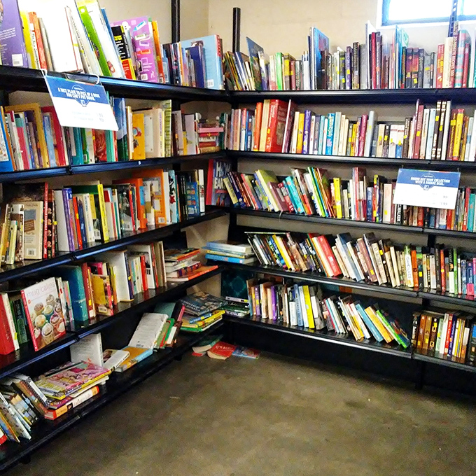 Books tower like literary skyscrapers, each spine holding stories waiting for their next chapter.
