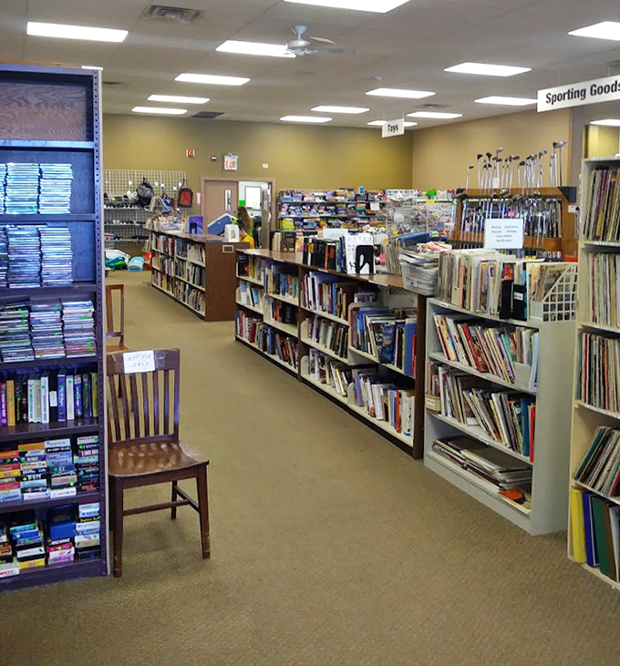 The book section: where literary treasures and forgotten bestsellers mingle like guests at a cocktail party. That wooden chair invites you to sample a page or two.