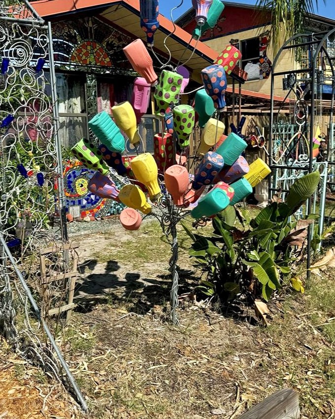Not your average garden tree. When watering cans bloom instead of flowers, you know you've entered the twilight zone of gardening.