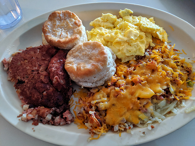 Biscuits that could make your grandmother jealous share the plate with perfectly scrambled eggs and hashbrowns that glisten with cheesy goodness.