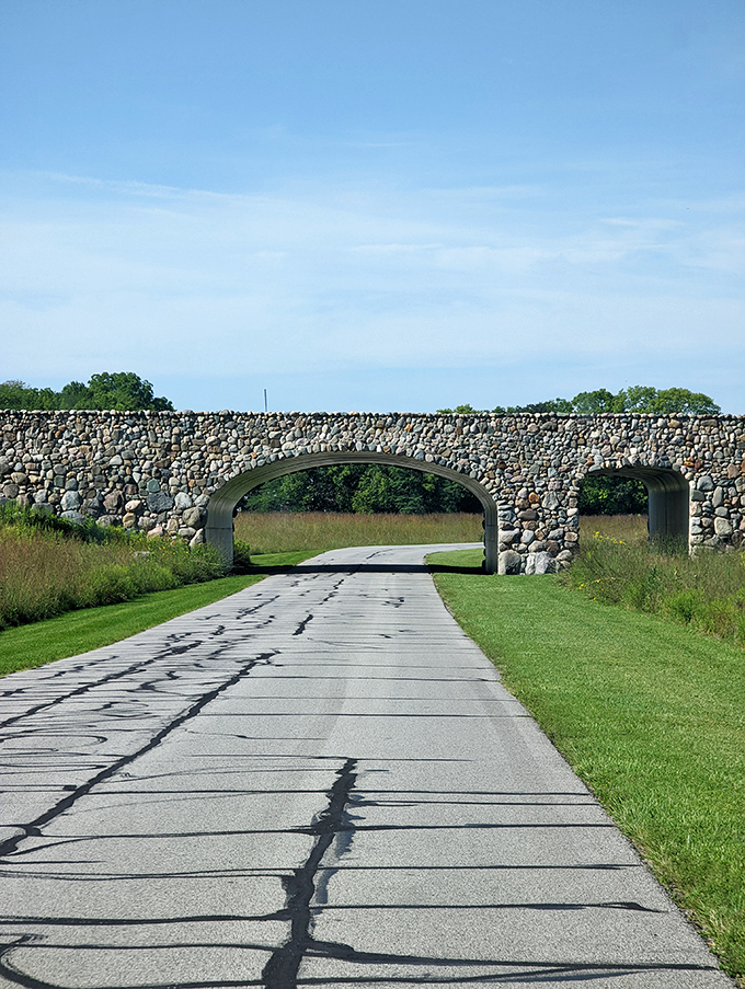 Not all bridges connect just two places. This magnificent stone arch creates a gateway between our modern world and the natural paradise beyond.
