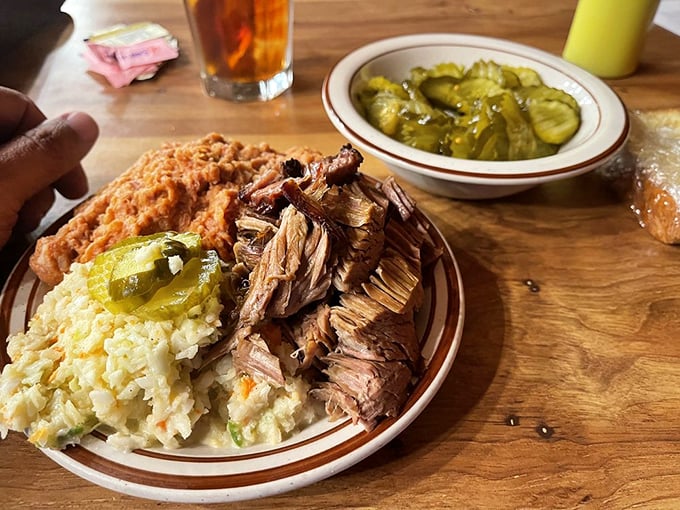 A plate that answers the eternal question: "Why choose one meat when you can have them all?" Barbecue democracy at its finest.