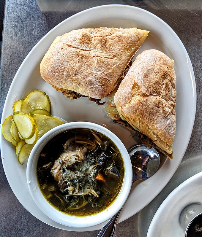 This sandwich-and-soup combo isn't just lunch—it's therapy in carb form, with house-made pickles providing that perfect acidic counterpoint.