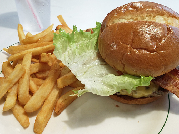 This isn't just a burger&mdash;it's architecture. The golden brioche, the precise lettuce-to-patty ratio, and those fries standing at attention.
