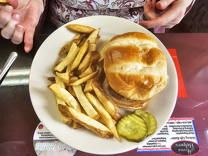 The burger and fries combo &ndash; proof that lunch at a breakfast joint isn't settling, it's strategic. That golden-brown potato perfection isn't an accident.