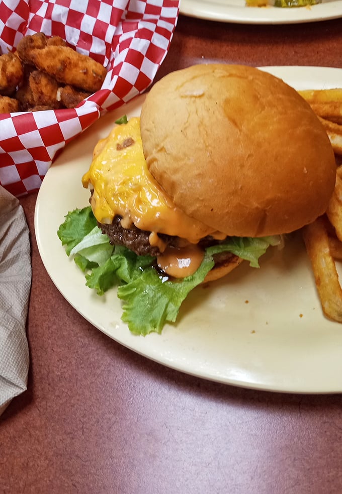 A burger that requires both hands and possibly a nap afterward&mdash;the melted cheese cascading down sides like a yellow waterfall.