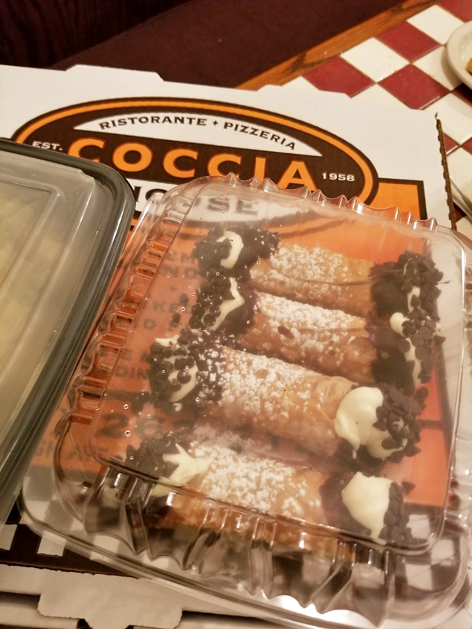 These cannoli aren't just desserts; they're edible treasure chests with crisp shells guarding creamy riches within, dusted with powdered sugar snow.
