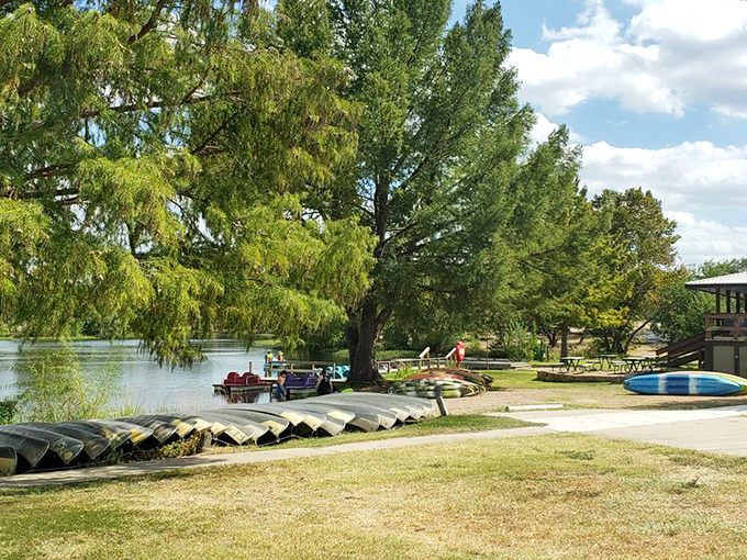 Canoes and kayaks wait patiently for their next adventure, like loyal dogs eager for a walk.