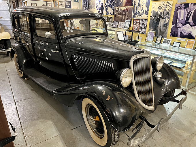 The bullet-riddled replica death car tells the story more vividly than any history book. Each hole represents the violent end to America's most notorious crime spree. 