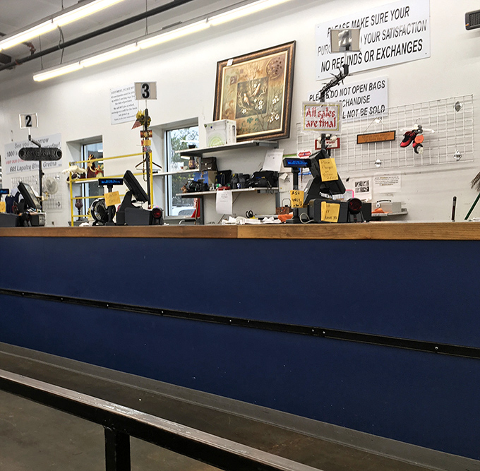 The checkout counter &ndash; final gateway between browsing and ownership. The "All Sales Final" sign is the thrift store equivalent of "No takebacks!"
